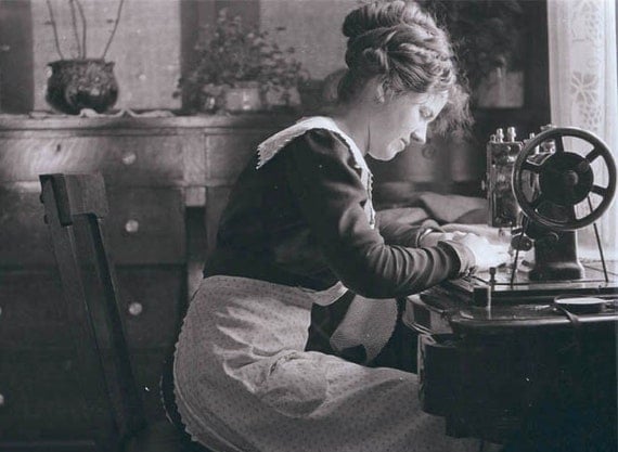 Vintage photo Print Seamstress at Her Sewing Machine in Window
