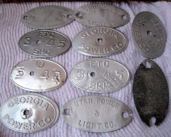 10 Vintage Oval aluminum utility pole tags
