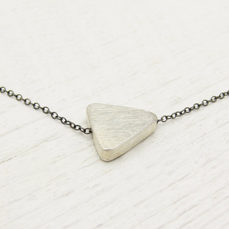 Geometric Triangle Simple Pendant Necklace in Hand by byjodi