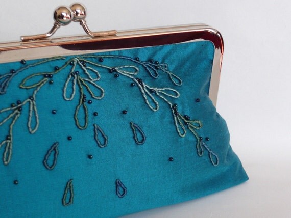 Items similar to Turquoise clutch bag with peacock blue embroidery and ...