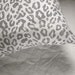 Gray hand block printed leopard spot on white linen by giardino