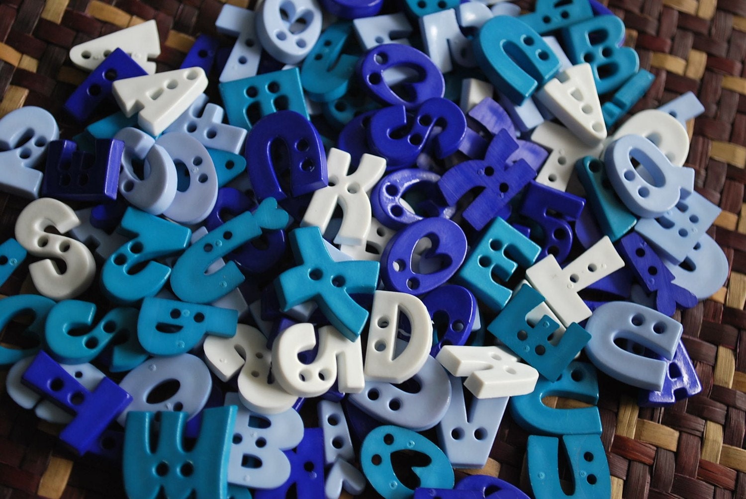 Letter Buttons Assorted shape and colour Blue tone by Meikkonen
