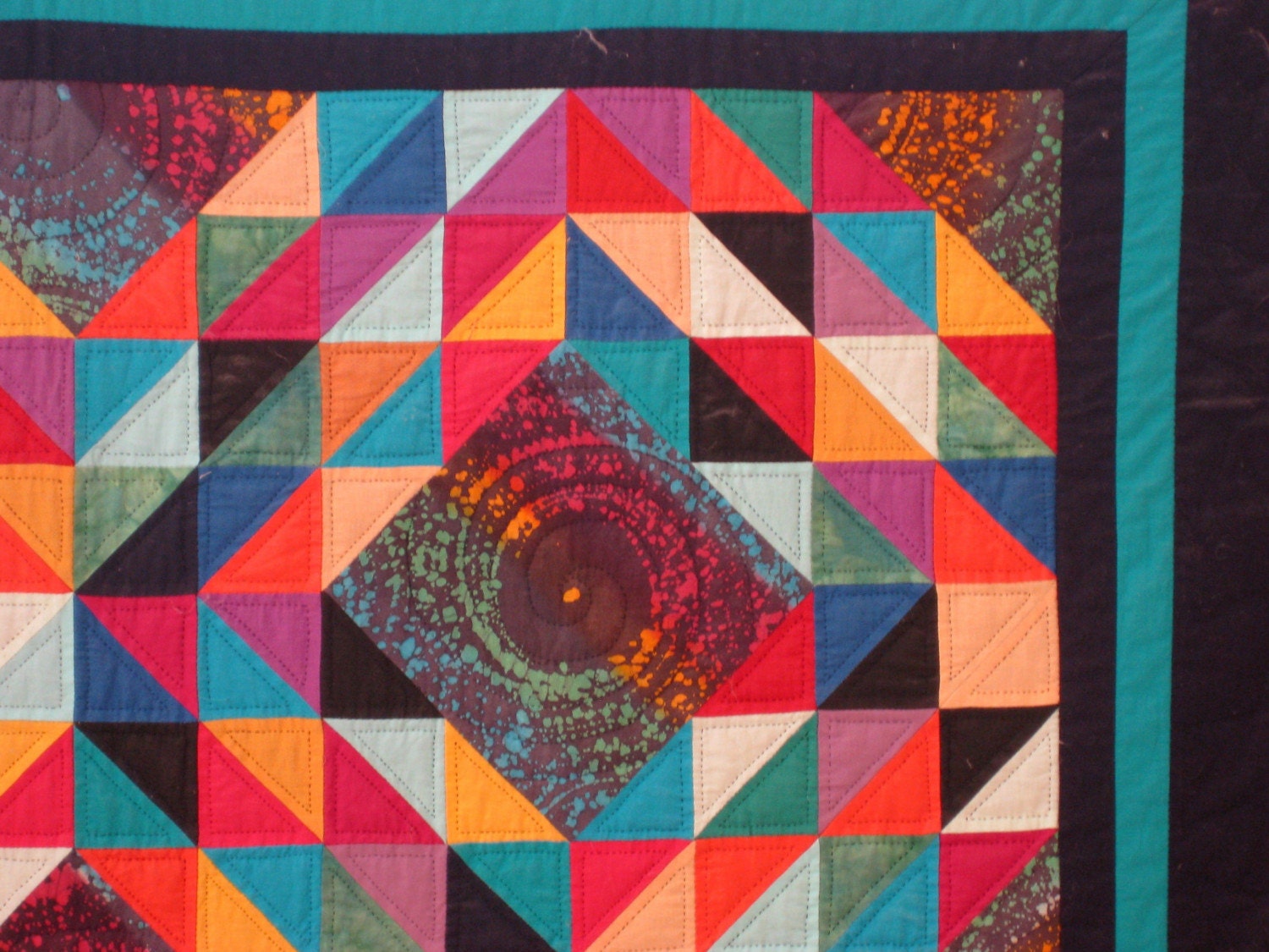 Quilt Ocean Waves in Jewel Colors against Blue Black