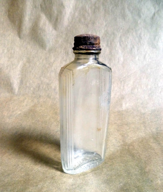 Vintage Glass bottle with rusty cap