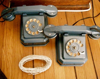 Two vintage 1950s walkie talkie metal children's toy phones