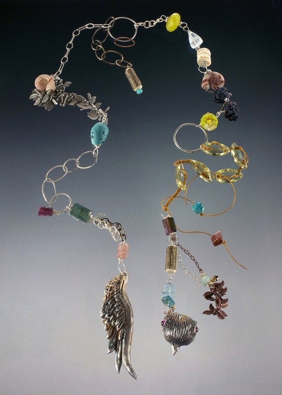 Items similar to Silver bird head and wing lariat on Etsy