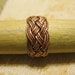 Hand-tied copper wire Turks Head Knot ring with a twist