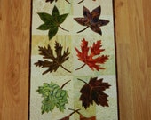 Items similar to Fall Leaf Table Runner, Quilted Batik Leaf Table Runner 14 x 34" on Etsy