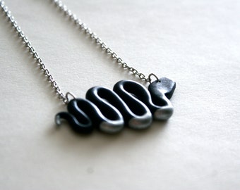 Items similar to Hot pink polymer clay flexible snake necklace on Etsy