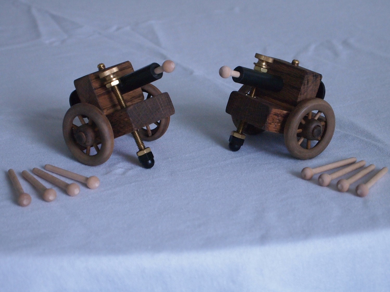 Spring-loaded wooden toy cannon