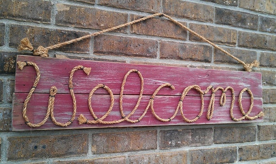 barn red rope wood welcome sign
