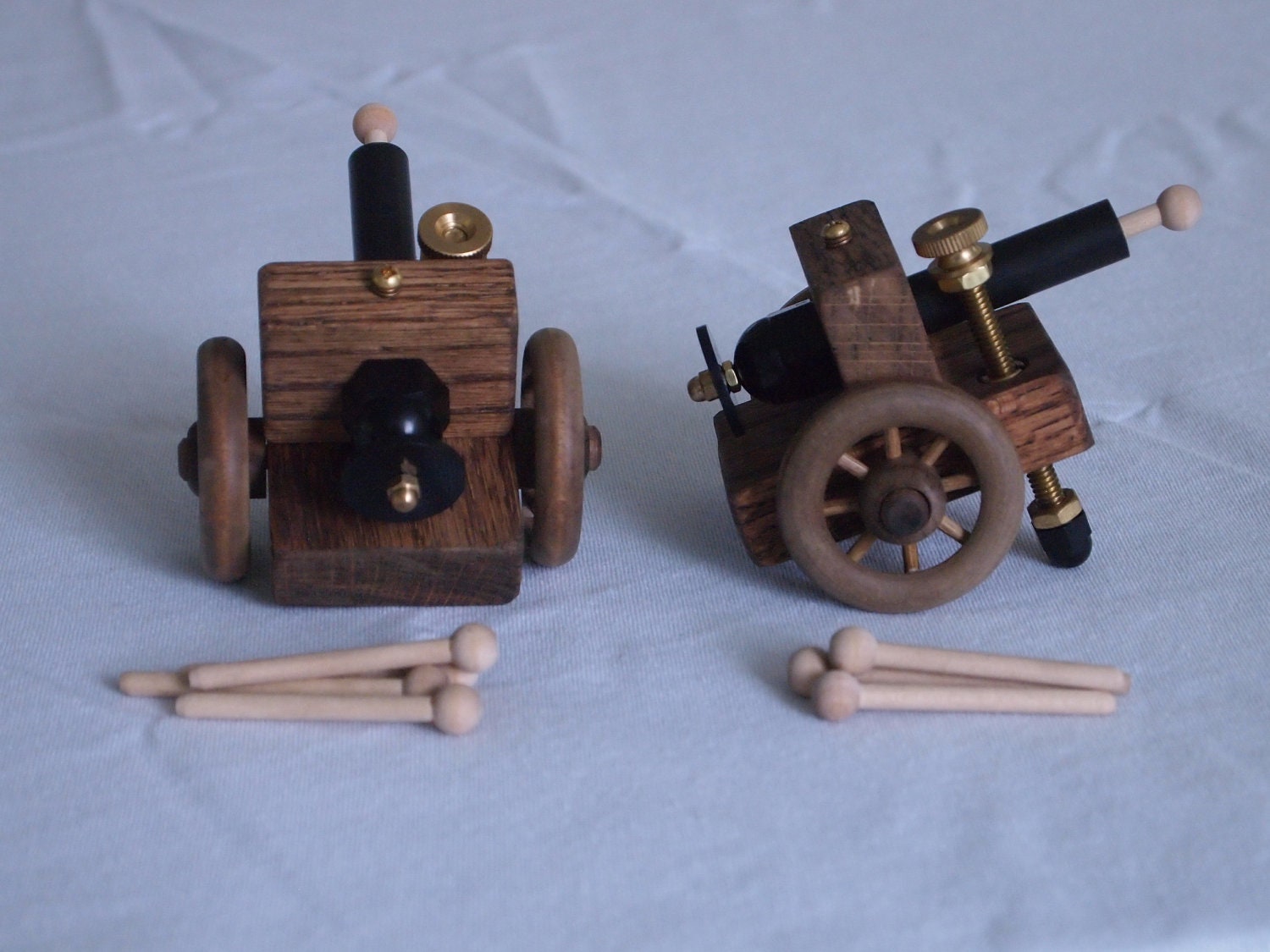 Spring-loaded wooden toy cannon