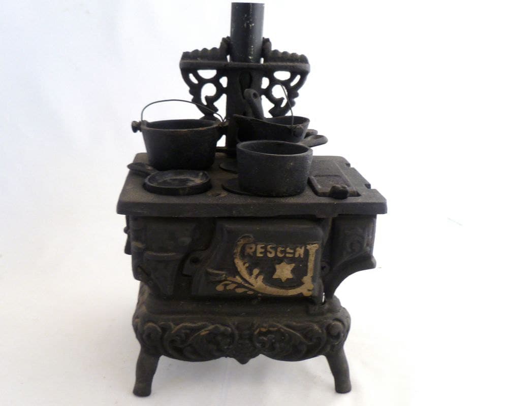 Vintage Cast Iron Toy Crescent Stove with pots and pans