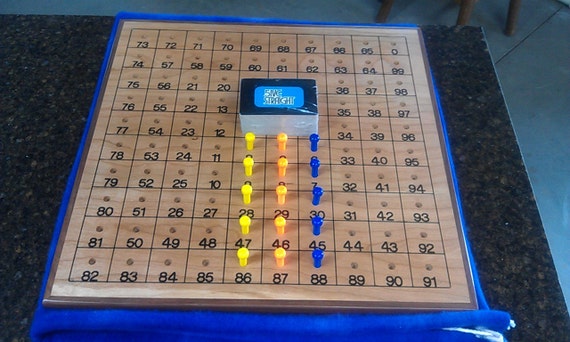 Five Straight board game with cards pegs and a storage bag