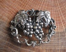 Popular items for repousse brooch on Etsy