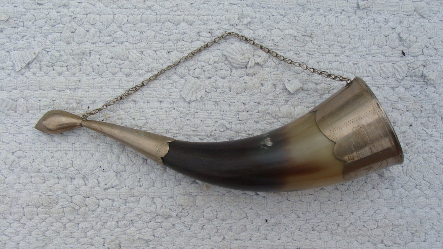 Vintage bone horn with metal bindings and chain. Lenght 9