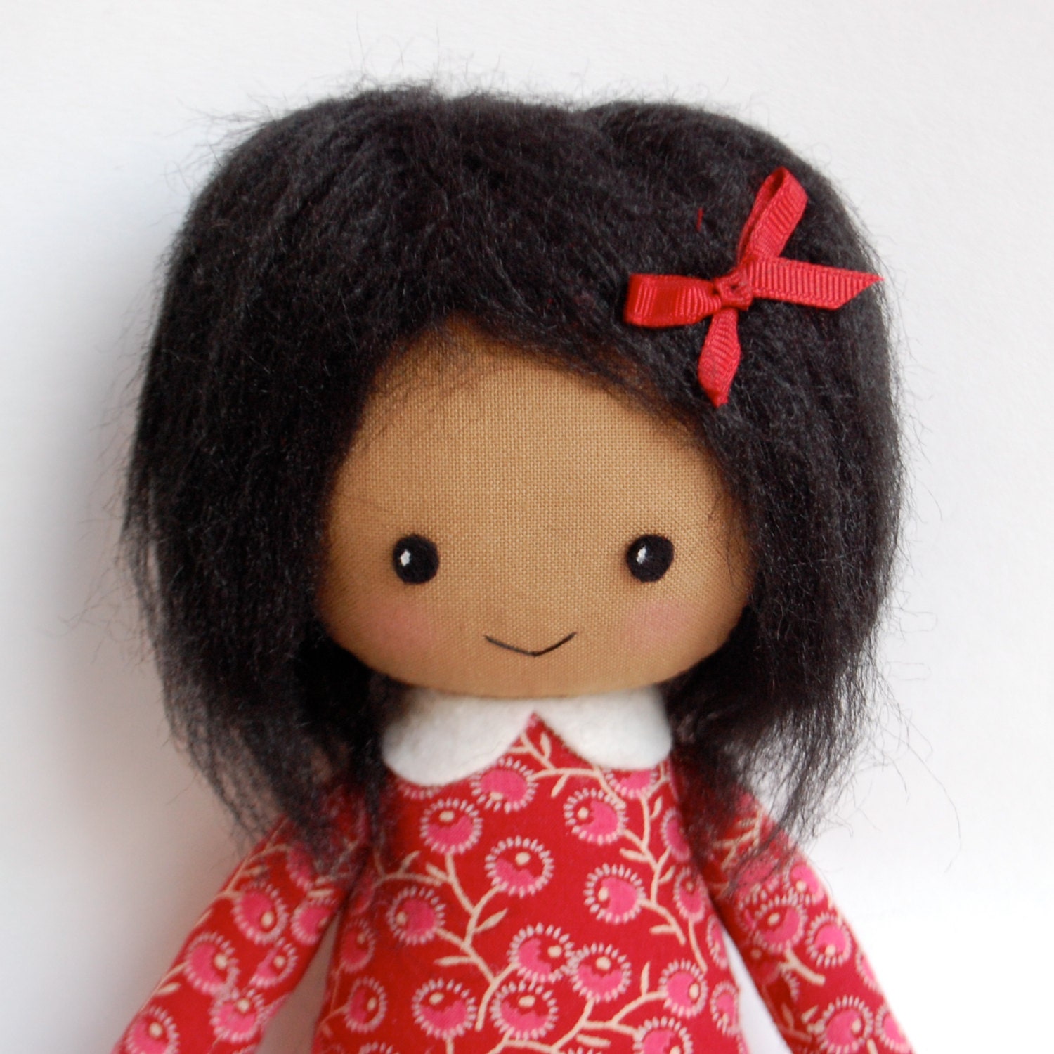 Rag doll black-haired rag doll asian hispanic doll in pink