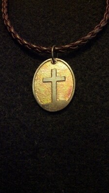 Cross coin jewelry pendant made from an acid-etched half dollar coin...
