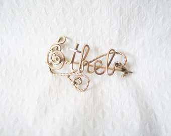 Very pretty, swirly brass costume pin brooch that spells "Ethel" in ...