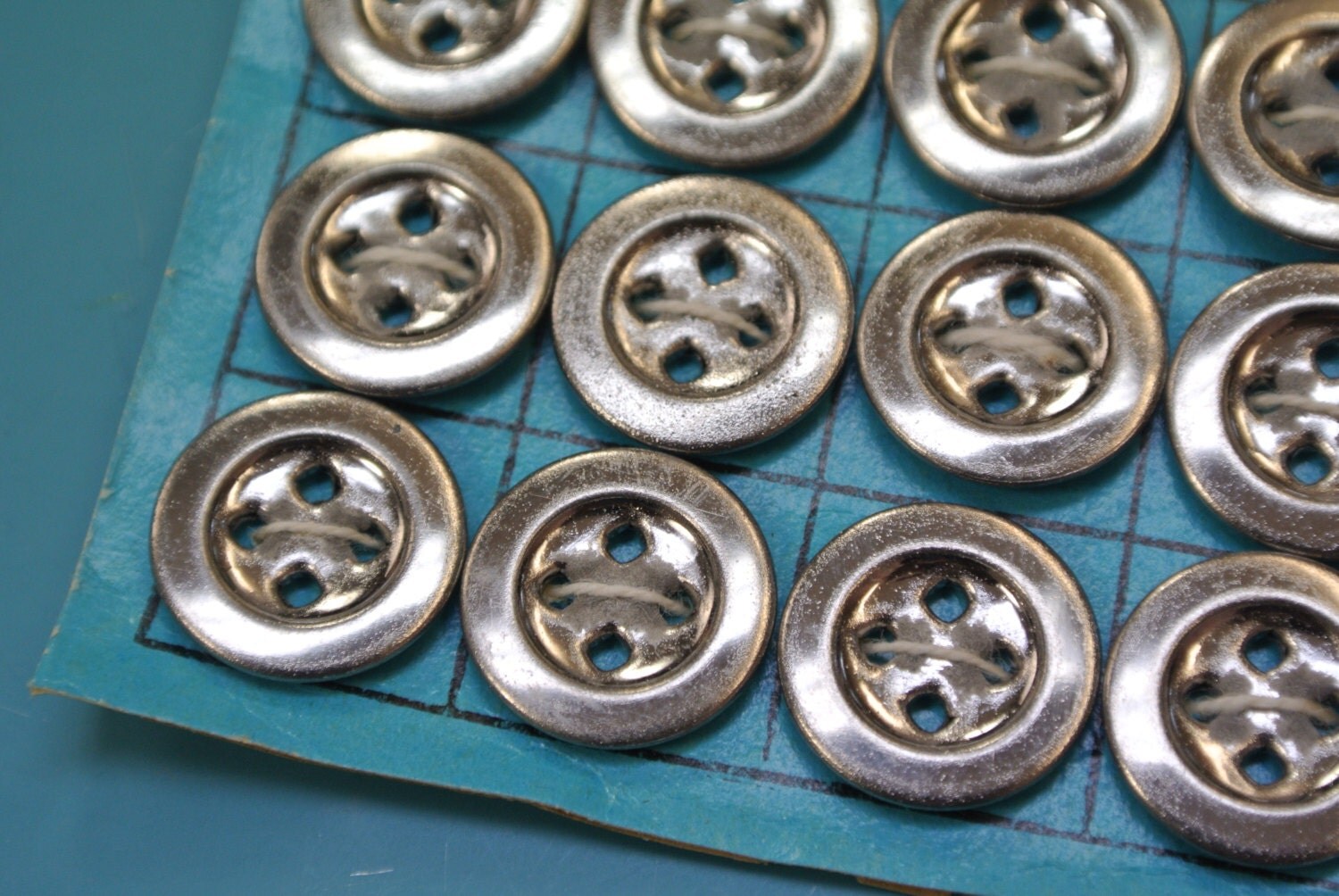 Lot of 36 small vintage 1940s unused silvercolor metal buttons still on ...