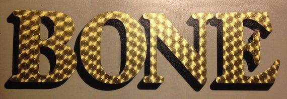 Name plate in engine turned gold vinyl