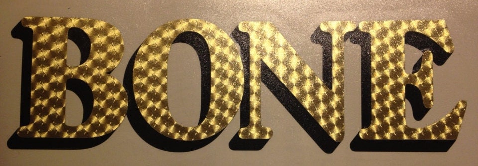 Name plate in engine turned gold vinyl