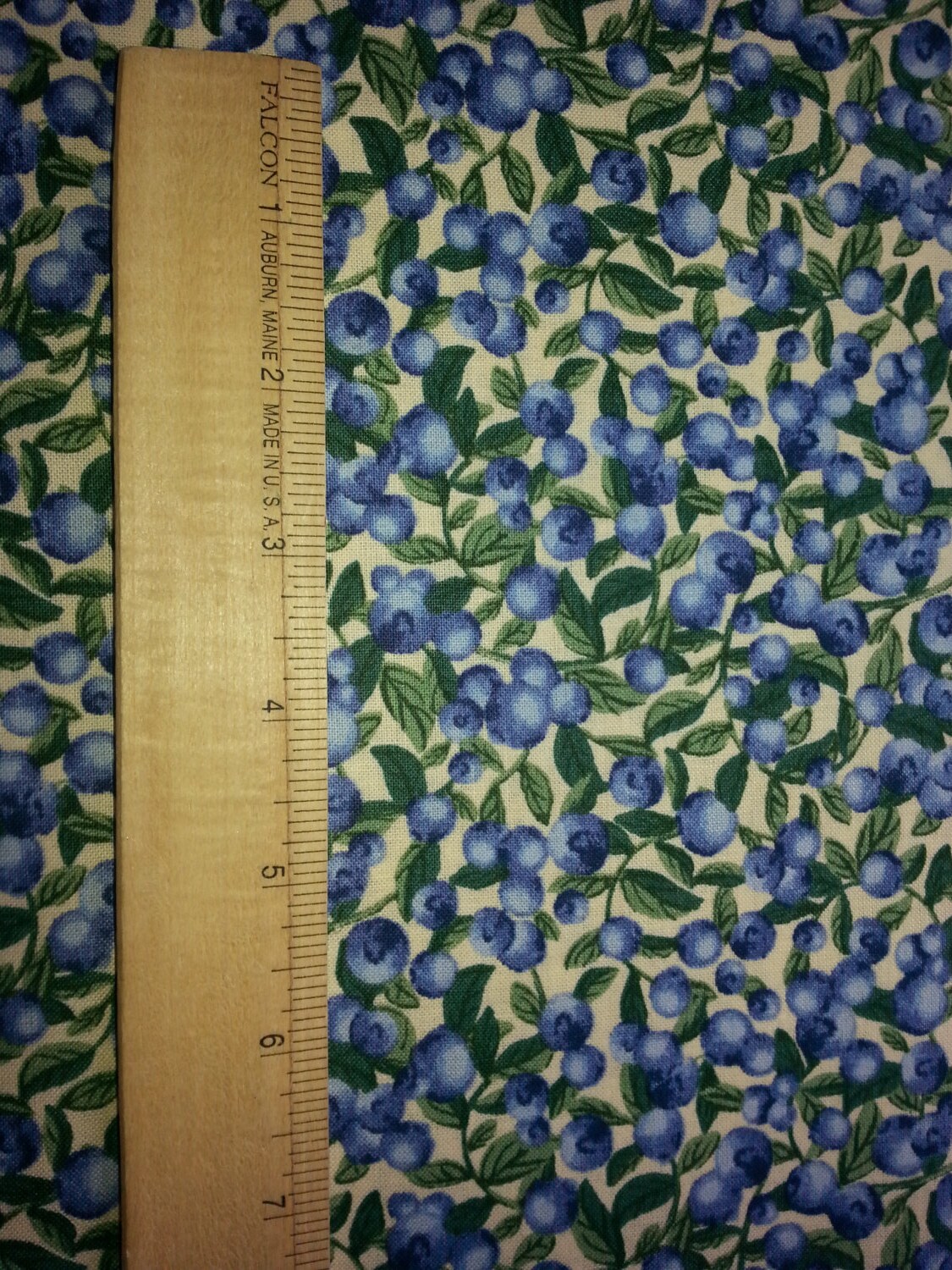 Blueberry print fabric on a cream background.