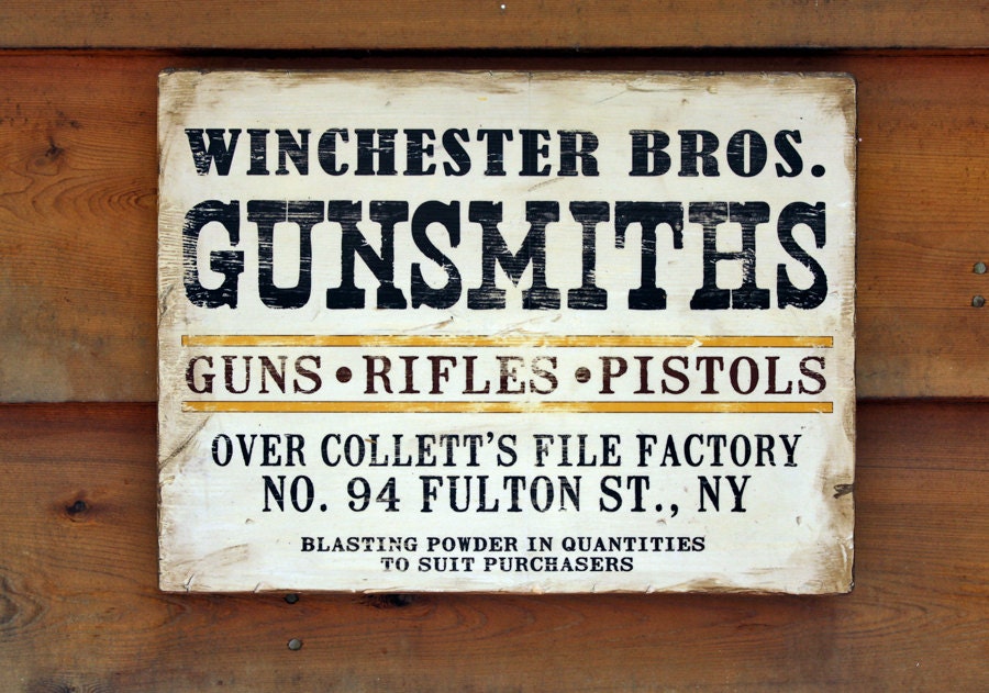 Rustic wooden sign 'Gunsmiths'