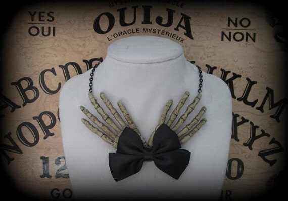 Items similar to Skeleton Hands Necklace on Etsy
