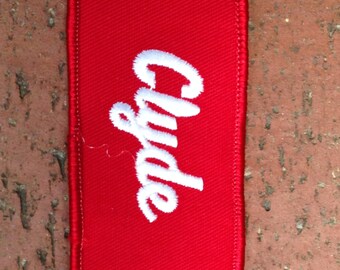 Zack. A yellow work shirt patch that says Zack in