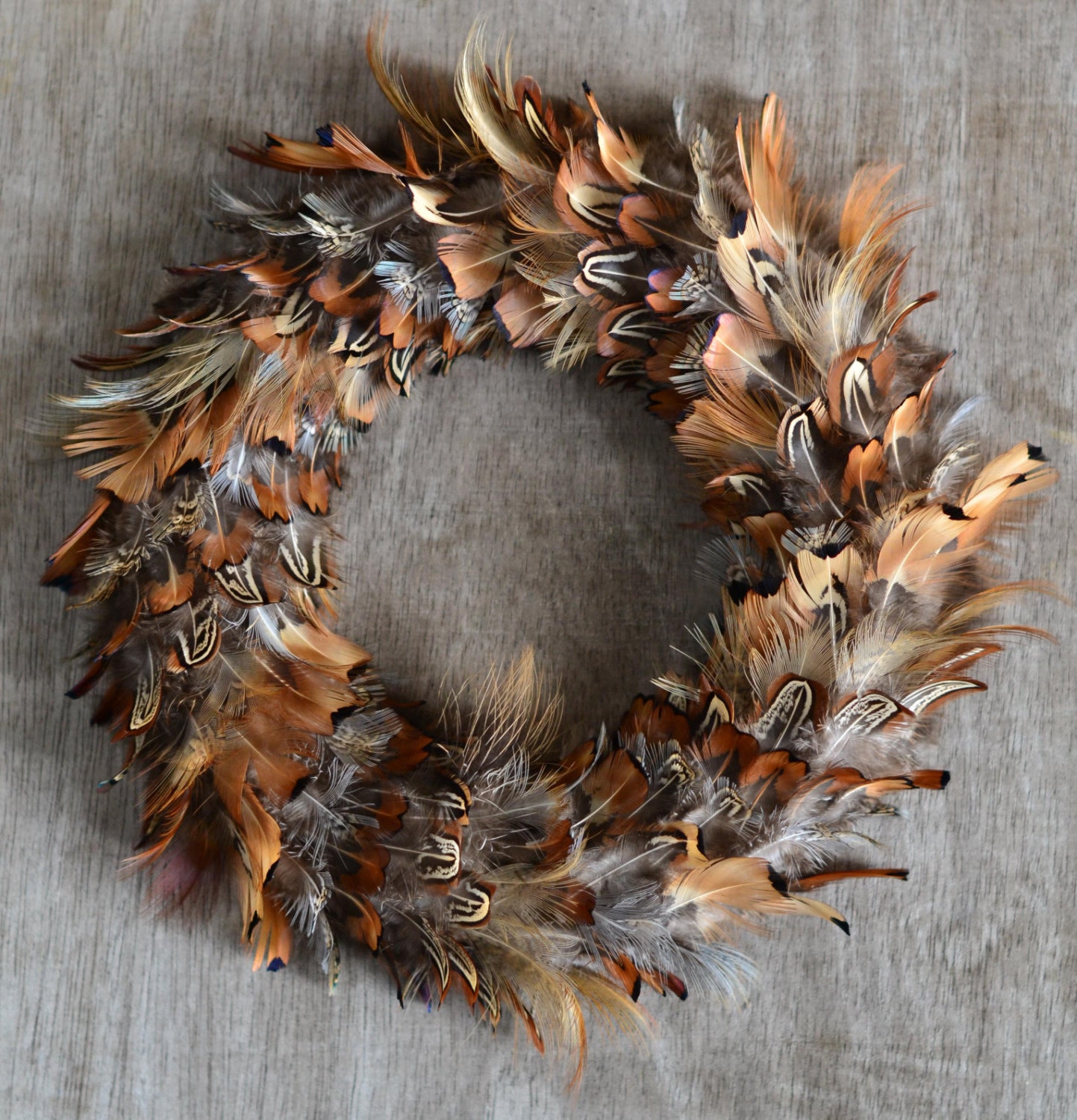 Handmade male pheasant feather wreath bound in suede with