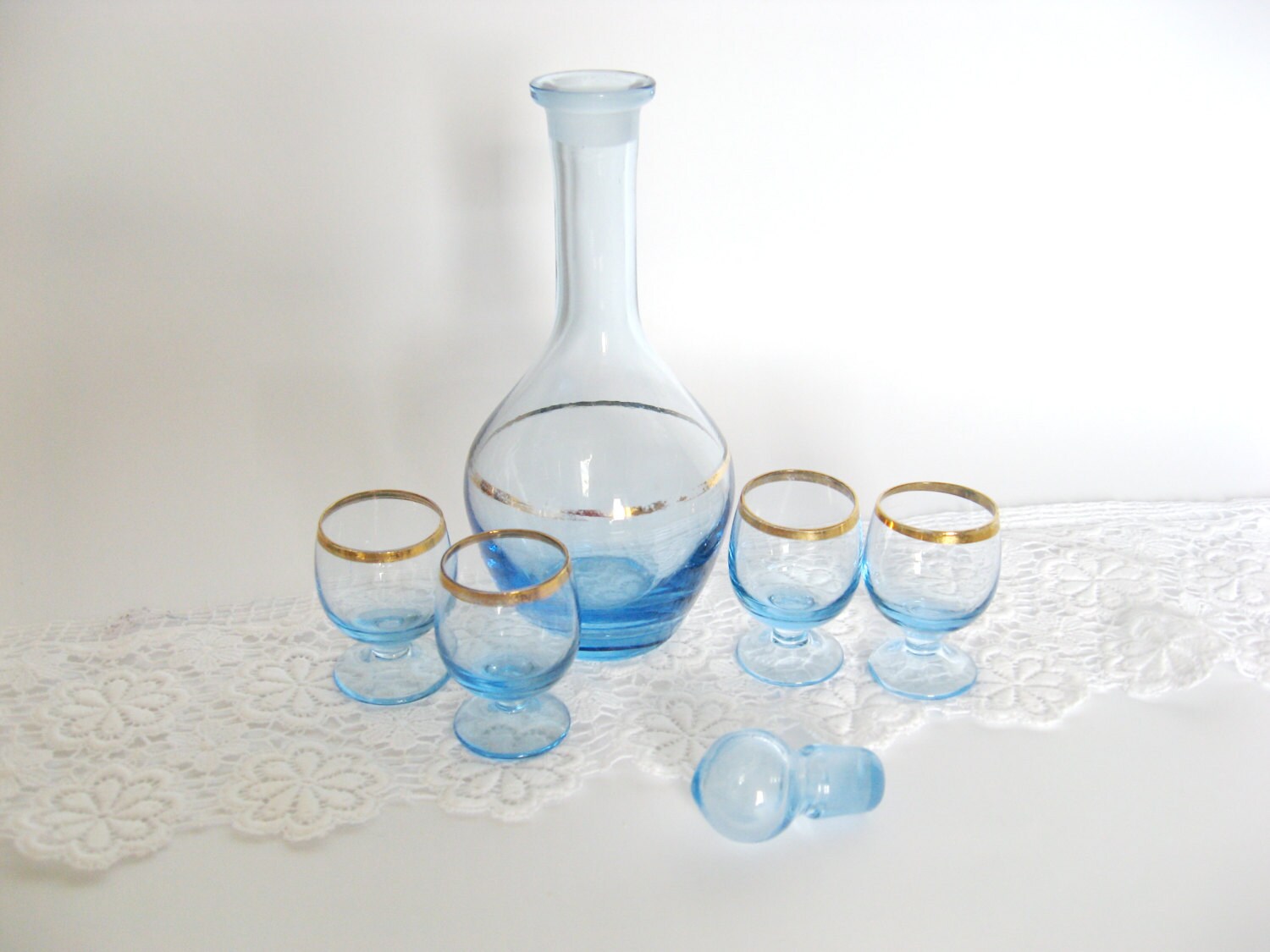 Colored glass decanter + 4 tiny stemmed cordial glasses/ blue glass ...