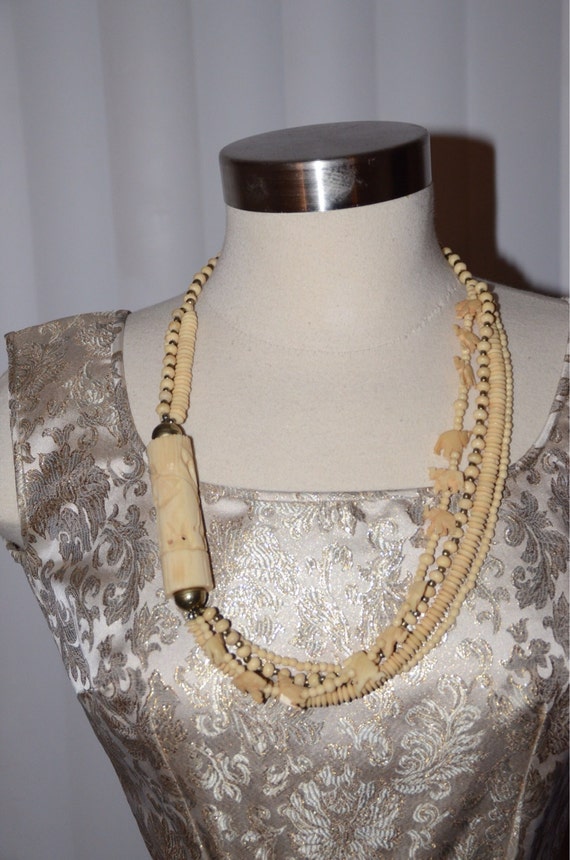 Items similar to Vintage Hand Carved Bone Estate Elephant Necklace on Etsy