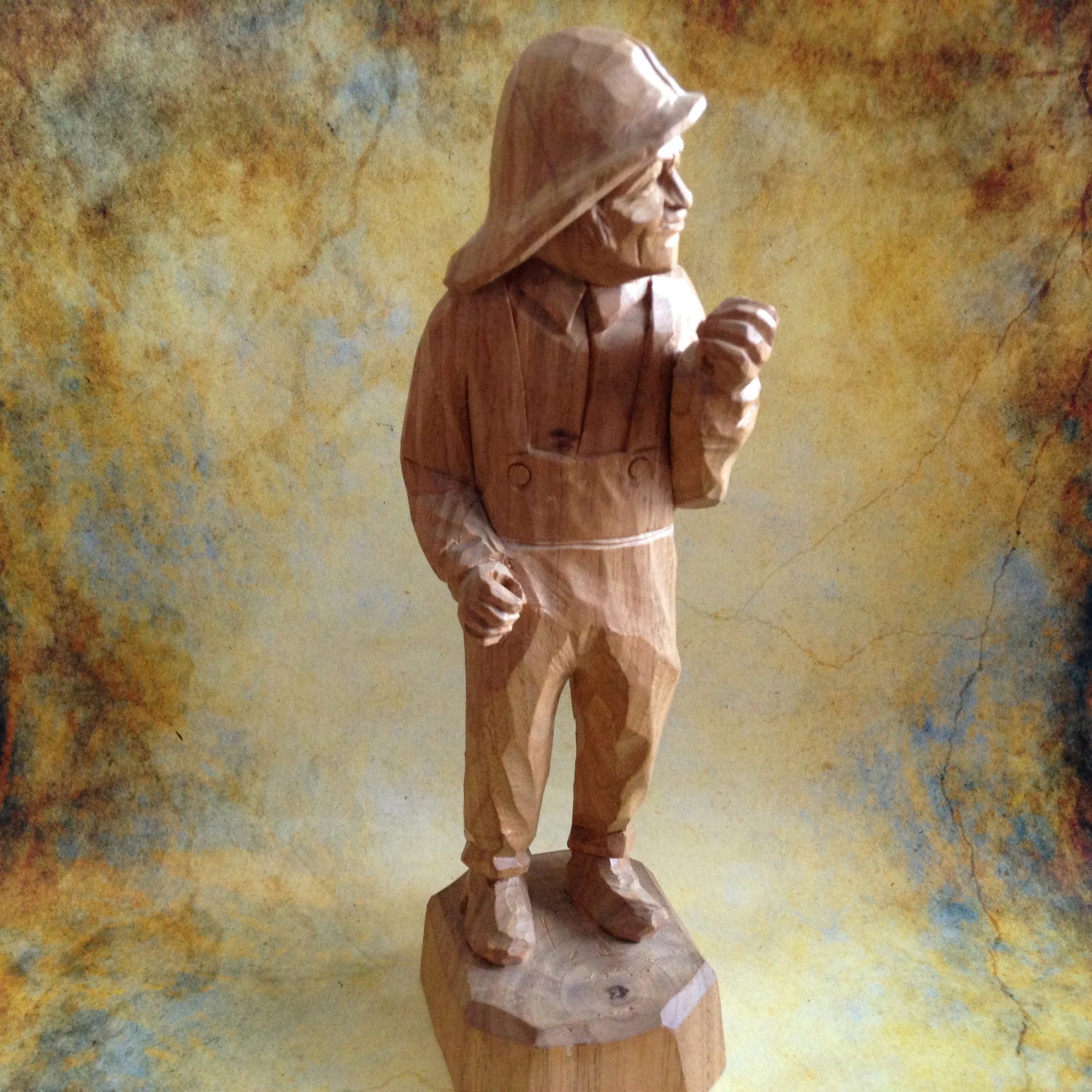 Vintage carved wooden man with hat by Marcel Guay