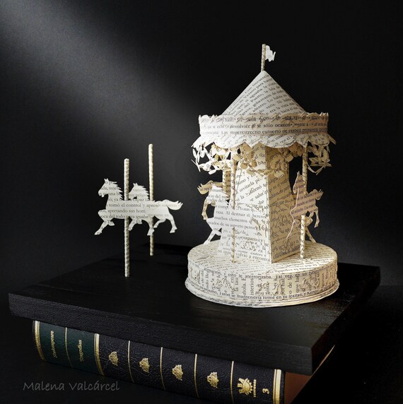 Book Paper Sculpture Paper Carousel on wood.