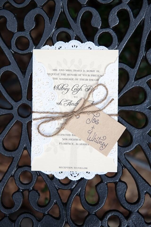 Wedding invitation with a faded tree on textured natural paper with a ...