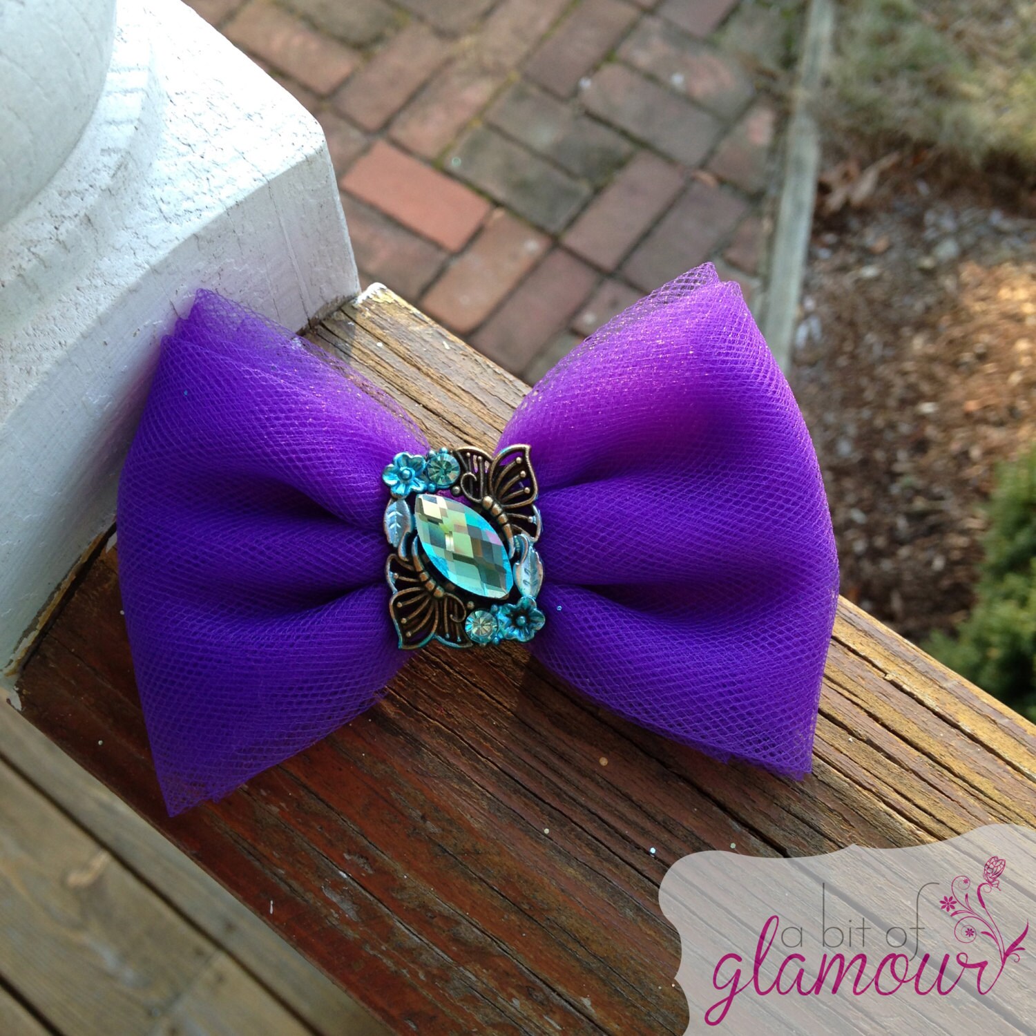 Purple Hair Bow with Turquoise Butterfly Gem by abitofglamour