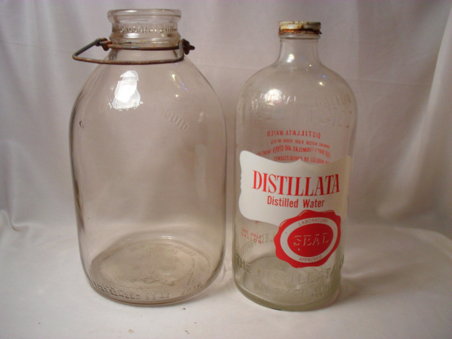 Lot Of 2 Vintage Glass Bottles One Gallon With Metal Handle