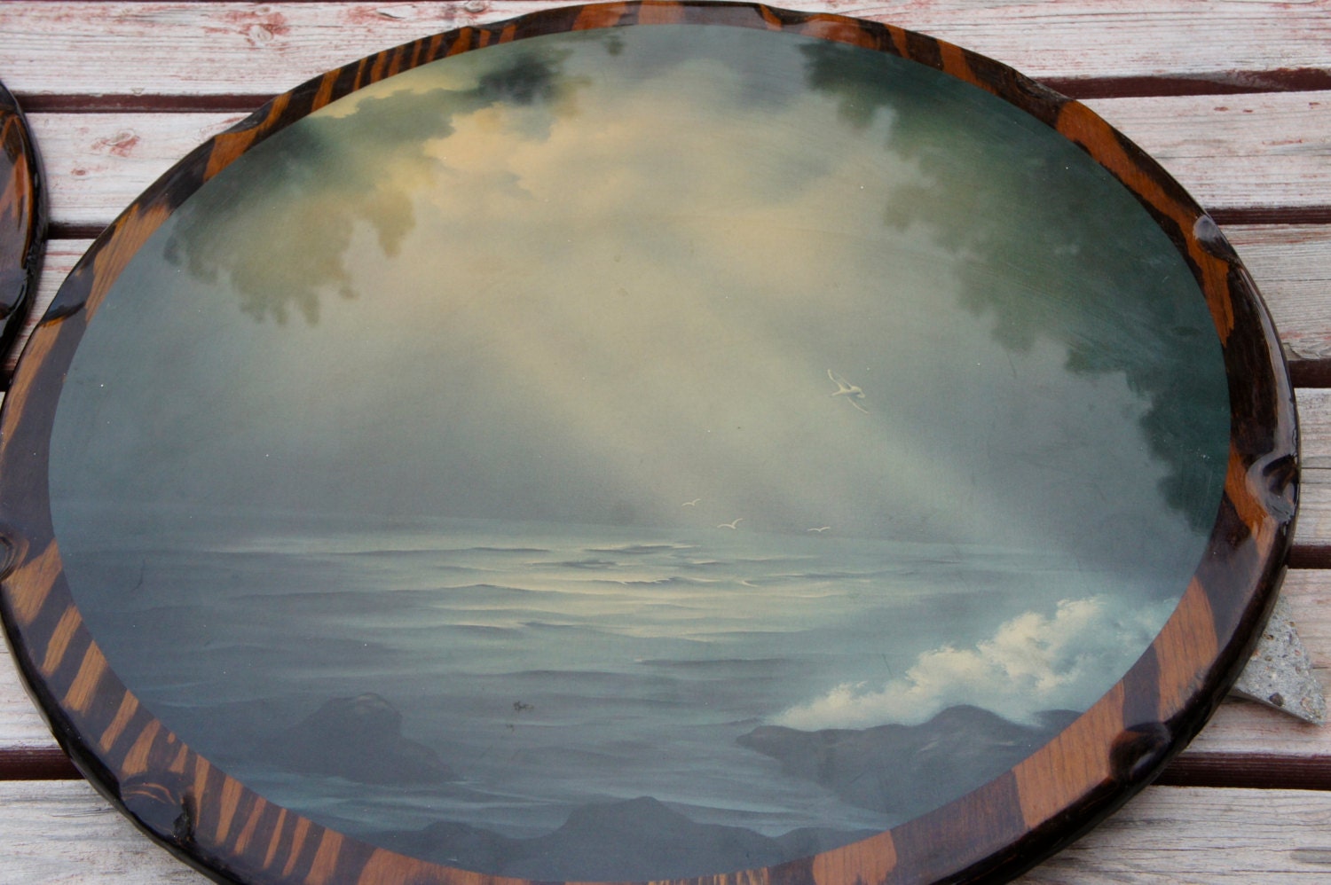 2 large round pictures on wood shellac dark wood ocean