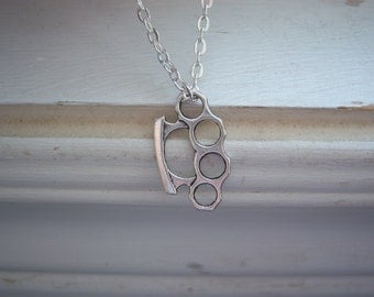 Brass knuckles necklace | Etsy