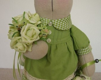 Tilda Cat Kizzy wearing a green dress, holding a bunch of roses and a ...