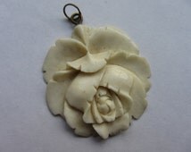 Popular items for carved rose pendant on Etsy