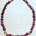 Ruby necklace with gold hexagon pendant