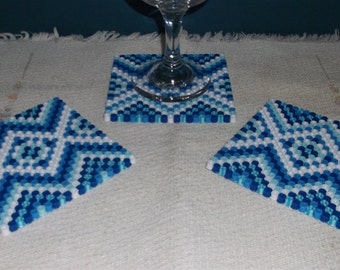 Blue and White are the colors of these square shaped handmade Perler ...