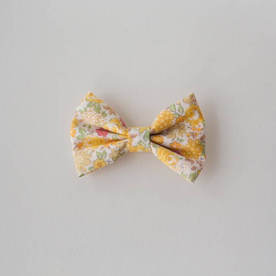 Items similar to Floral bow -- hair clip -- yellow on Etsy
