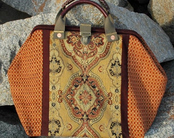 Carpet bag with a tapestry panel on a paprika, gold, sage speckled ...