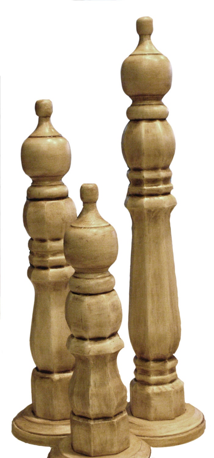 Handmade all wooden off white finials that have been