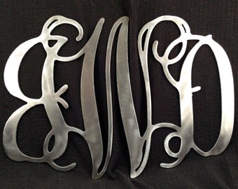 This metal monogram will look great adorning any front door or in your ...
