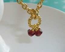 Popular items for gold garnet necklace on Etsy
