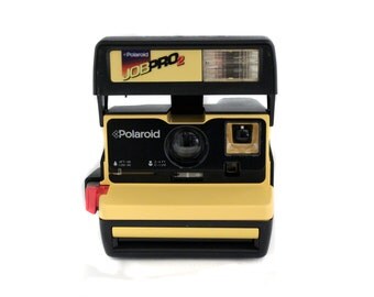 Polaroid 2000 Land Camera Green Button by VintageAndOtherThing